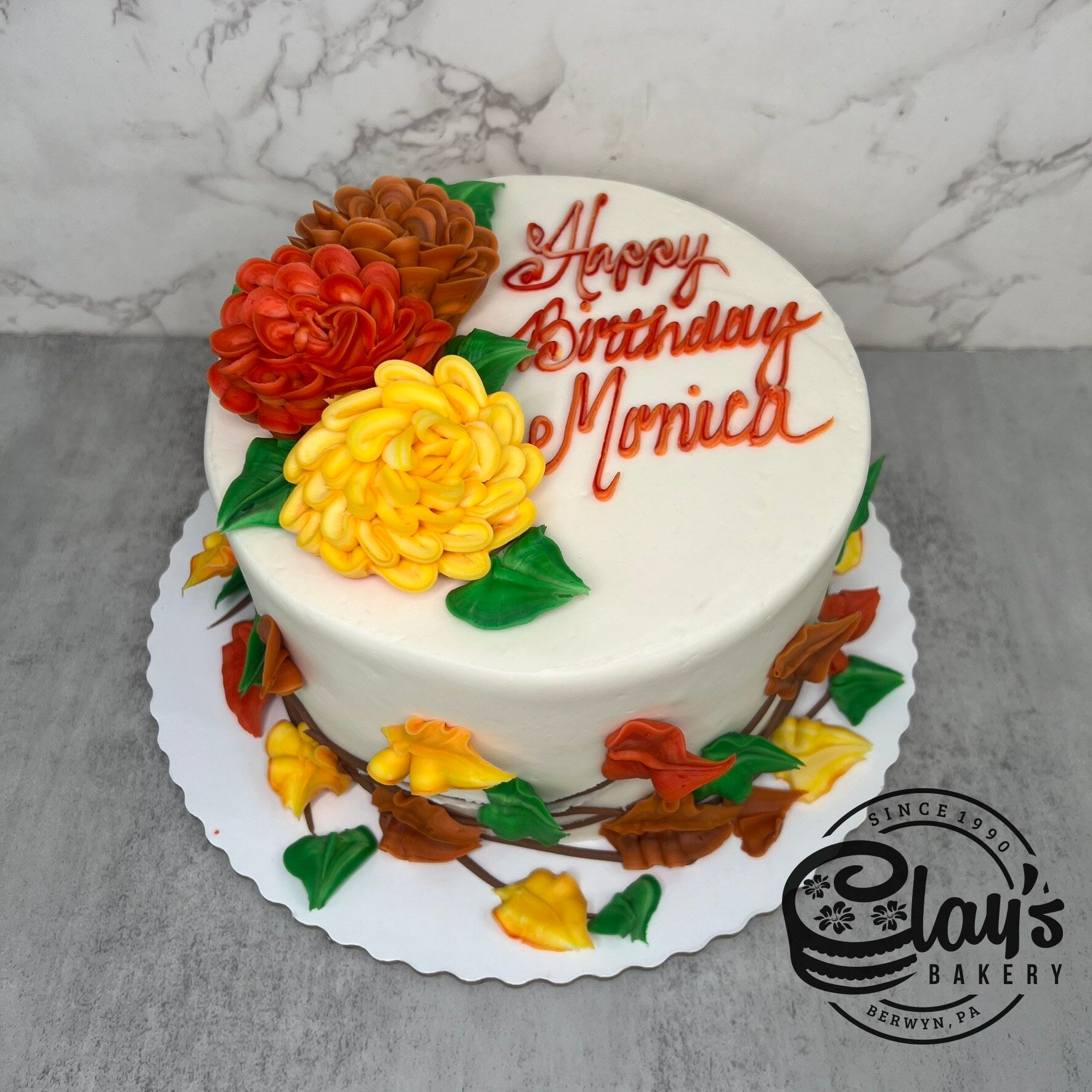 Mums and Autumn Leaves – Clay's Bakery